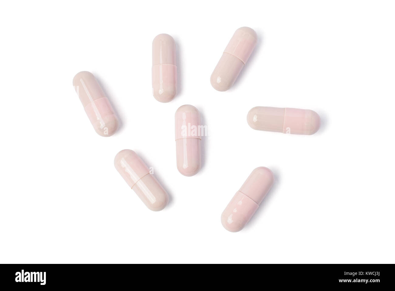 Pink capsule pills isolated a on white background Stock Photo - Alamy