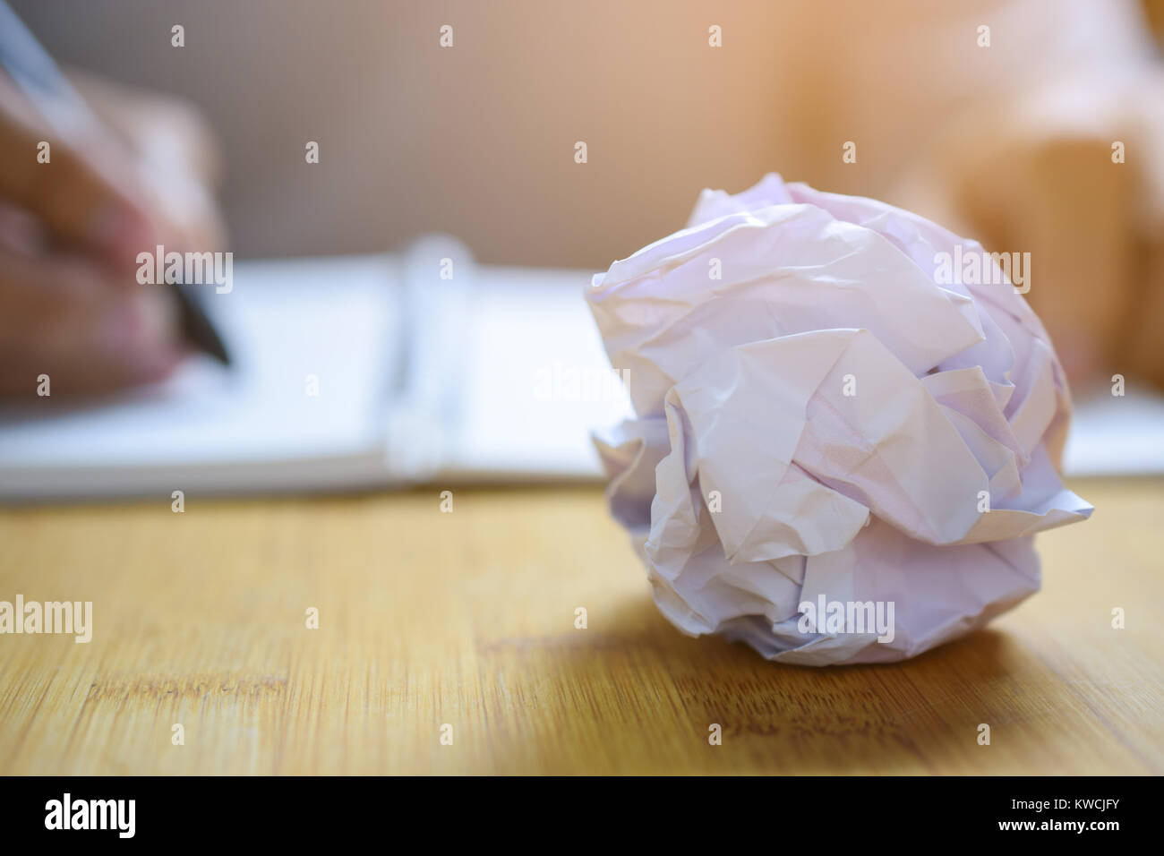 crumpled paper ball on table - closeup Stock Photo - Alamy