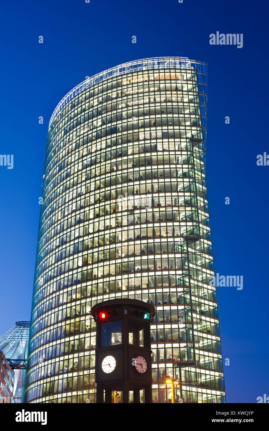 Skyscraper and a small clock tower at Potsdamer Platz in Berlin Stock ...