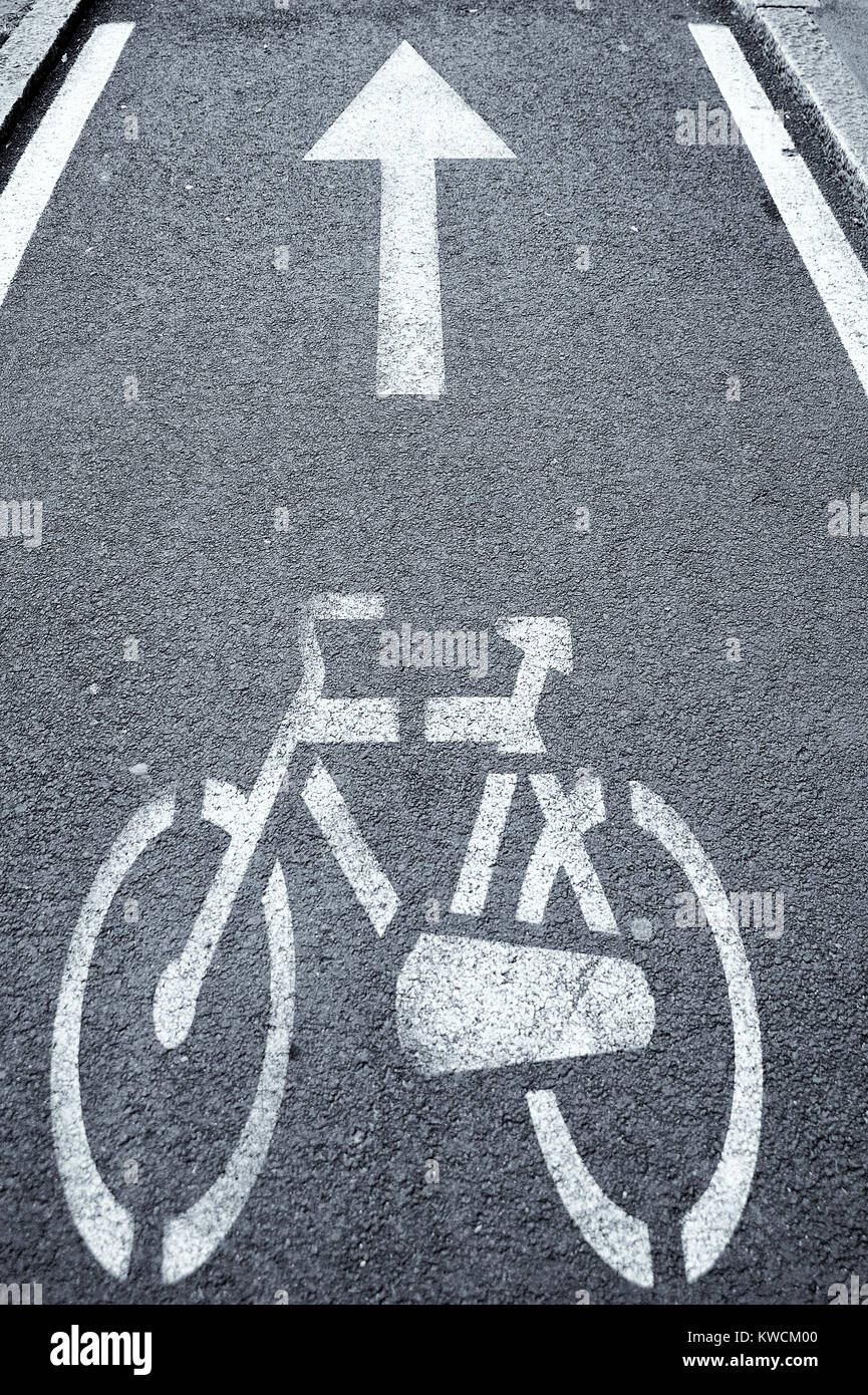 Bike path - bicycle and arrow painted on asphalt - road markings Stock ...