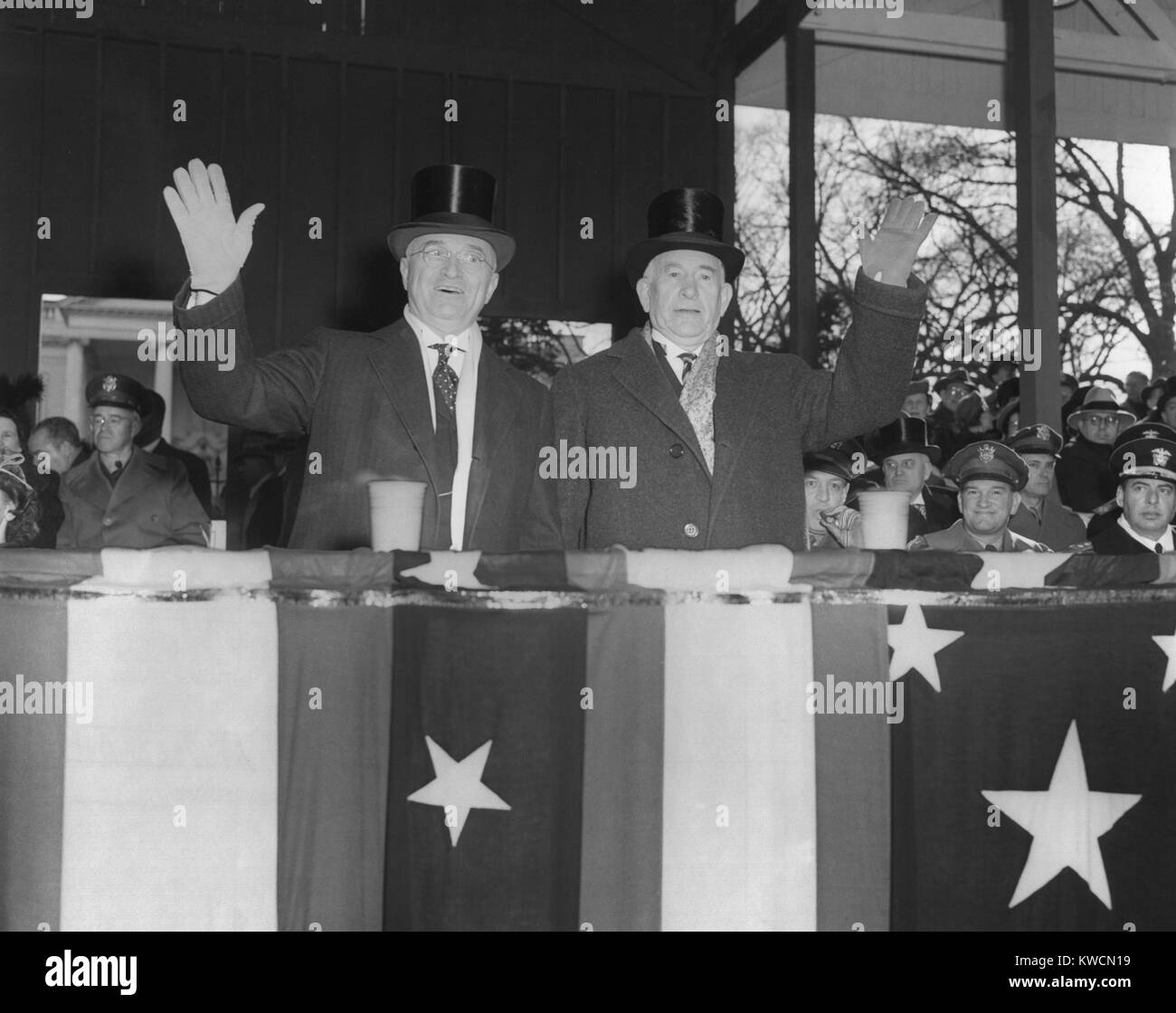 President Harry Truman and VP Alben Barkley wave to cameras during the ...