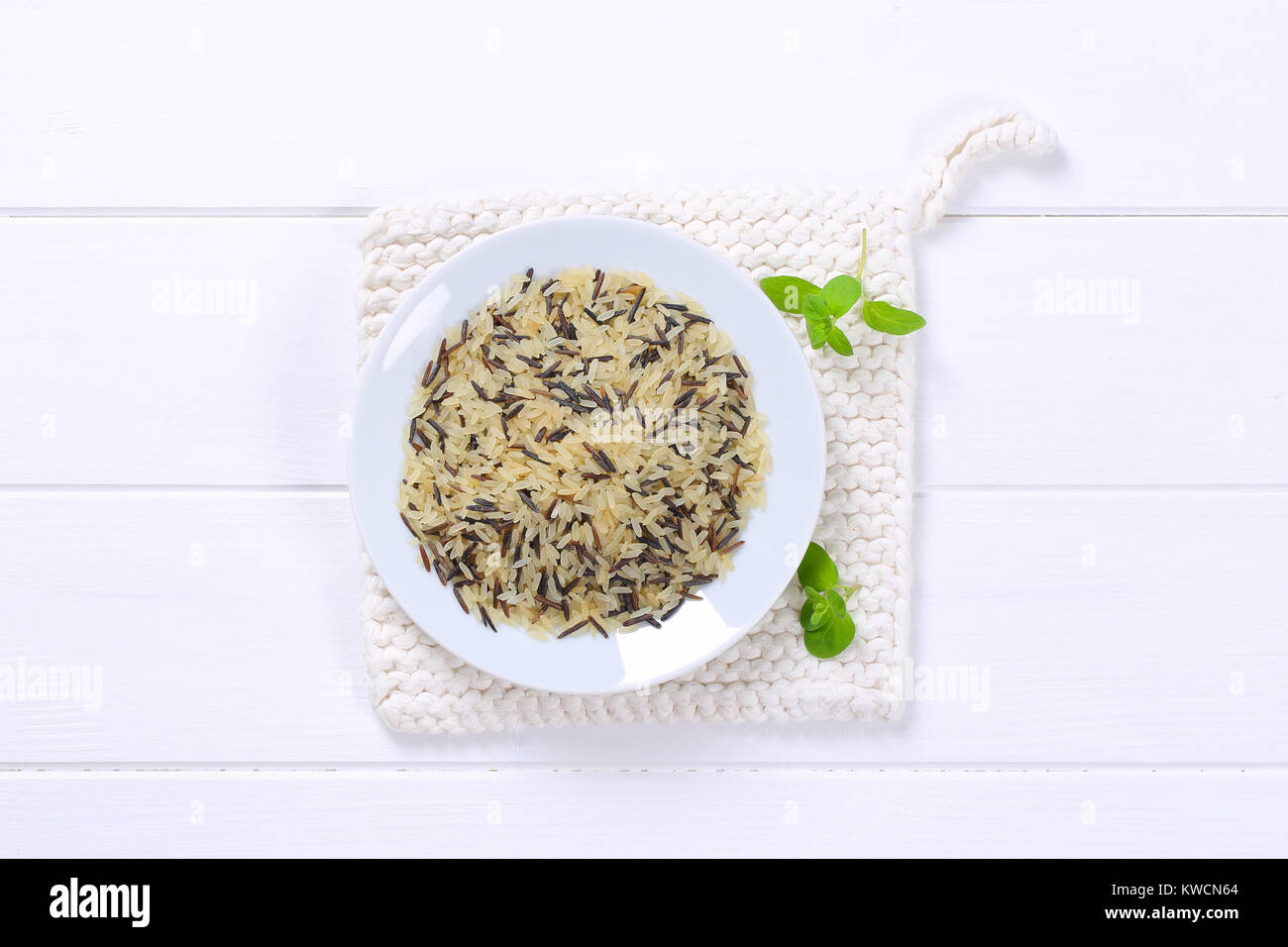 plate of wild rice on white table mat Stock Photo - Alamy