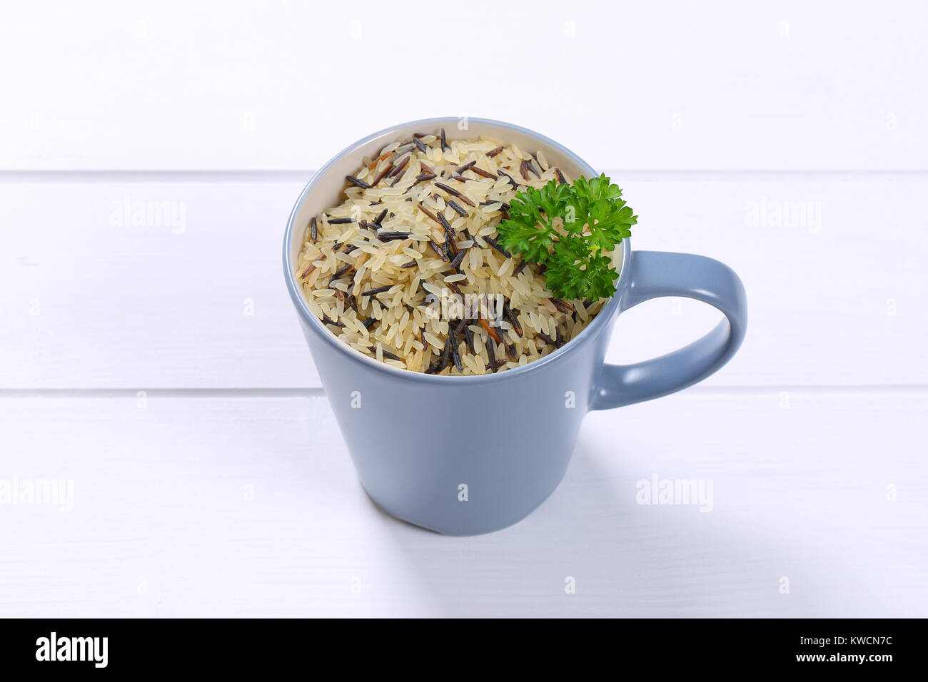 cup of wild rice on white wooden background Stock Photo - Alamy