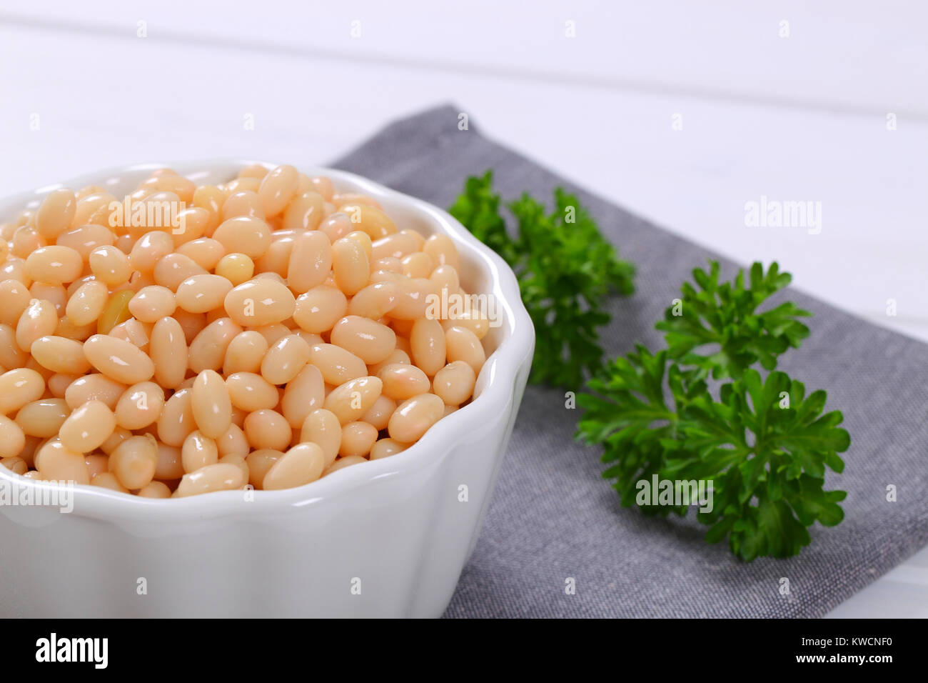 bowl of canned white beans on grey place mat - close up Stock Photo - Alamy
