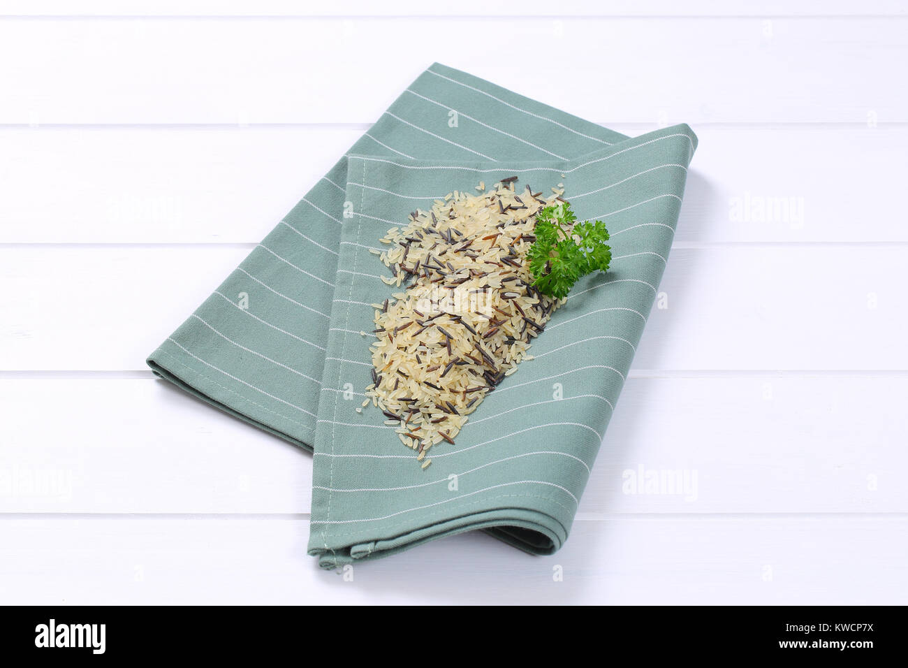 pile of wild rice on grey place mat Stock Photo - Alamy