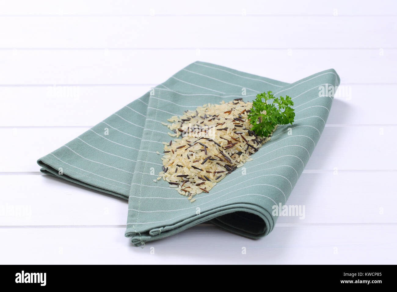 pile of wild rice on grey place mat Stock Photo - Alamy