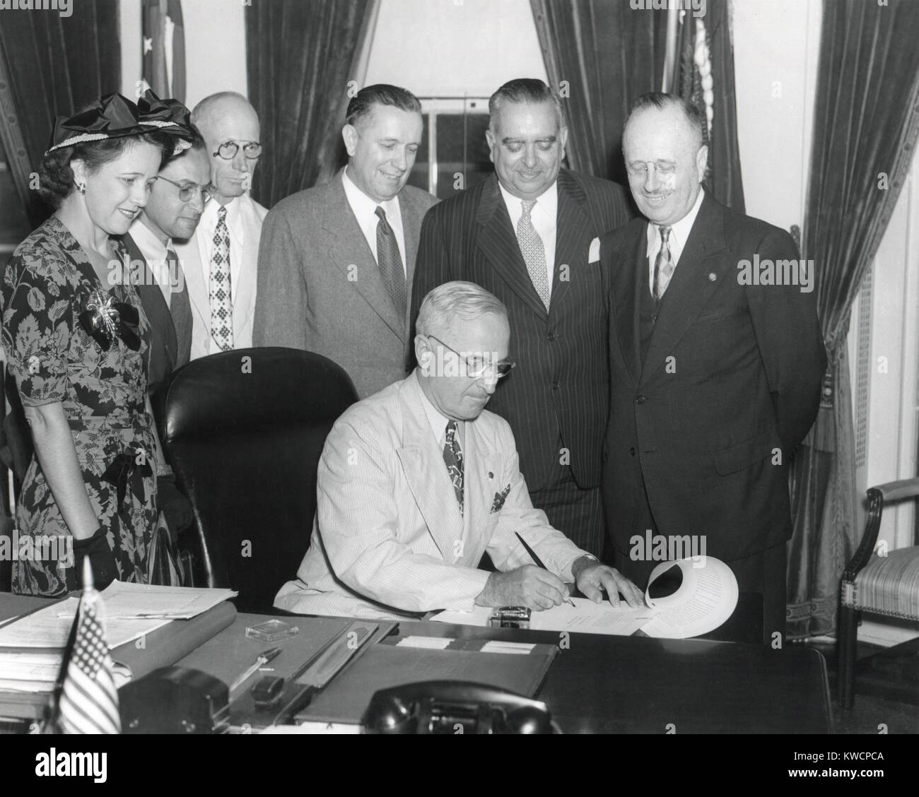President Harry Truman signing a bill regarding Puerto Rico, Aug. 5 ...