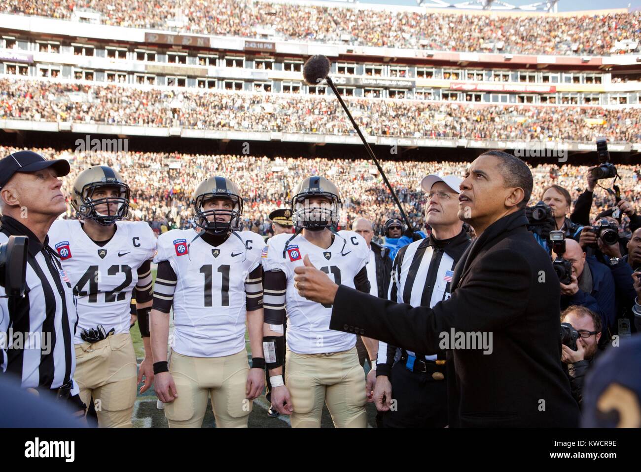 President Barack Obama performs the coin toss before the annual Army vs ...