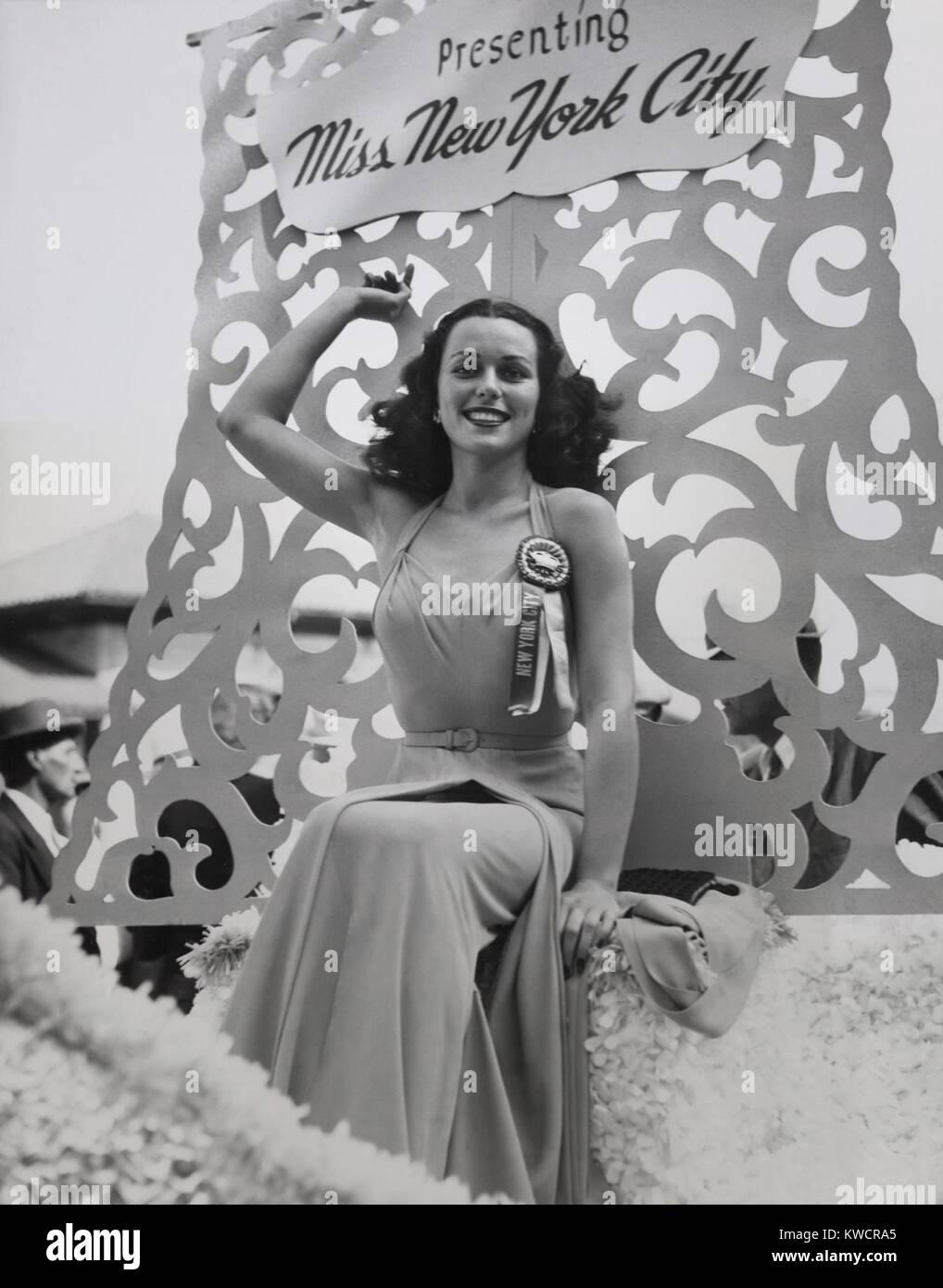 Bess Myerson, seated on the Miss New York City float during the parade ...