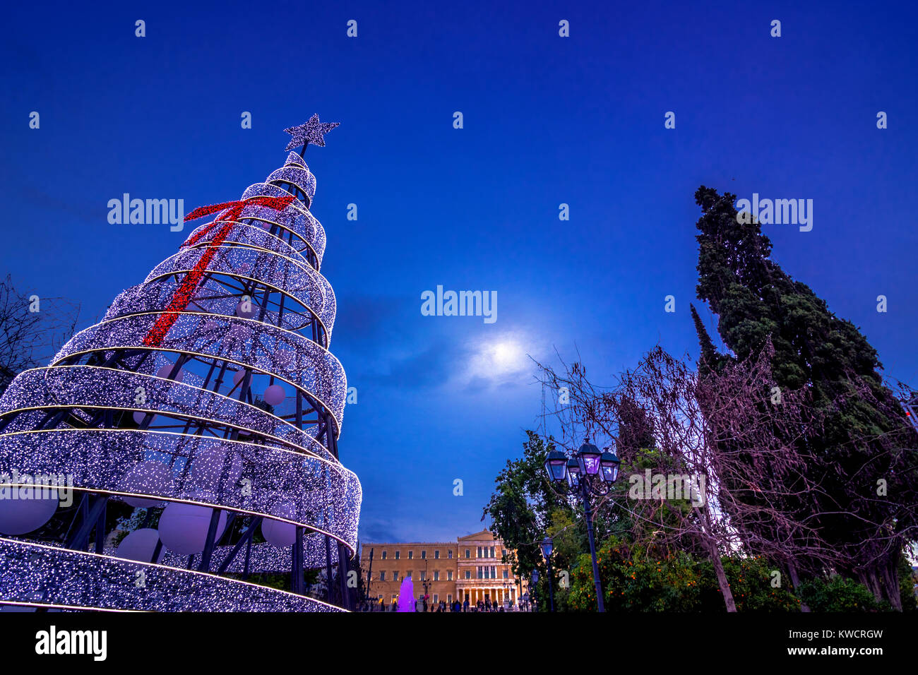 Lit Christmas tree in Syntagma square in Athens, Greece with parliament ...
