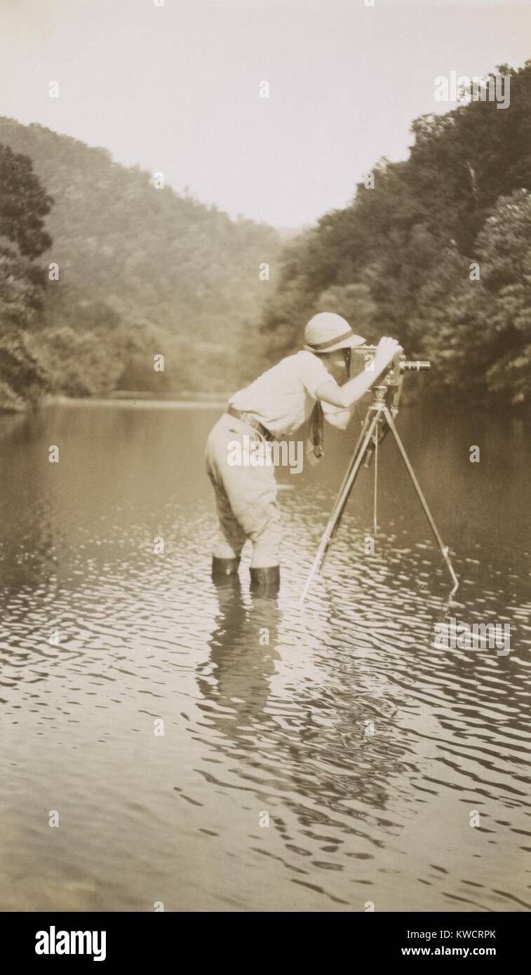 Marvin Breckinridge Patterson taking a photograph while standing in a ...