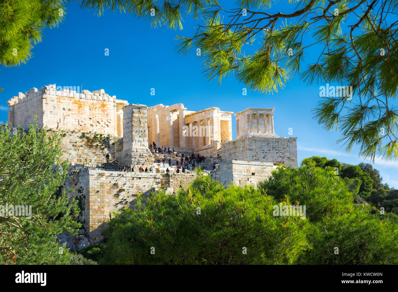 Acropolis with Parthenon. View through a frame of green plants and ...