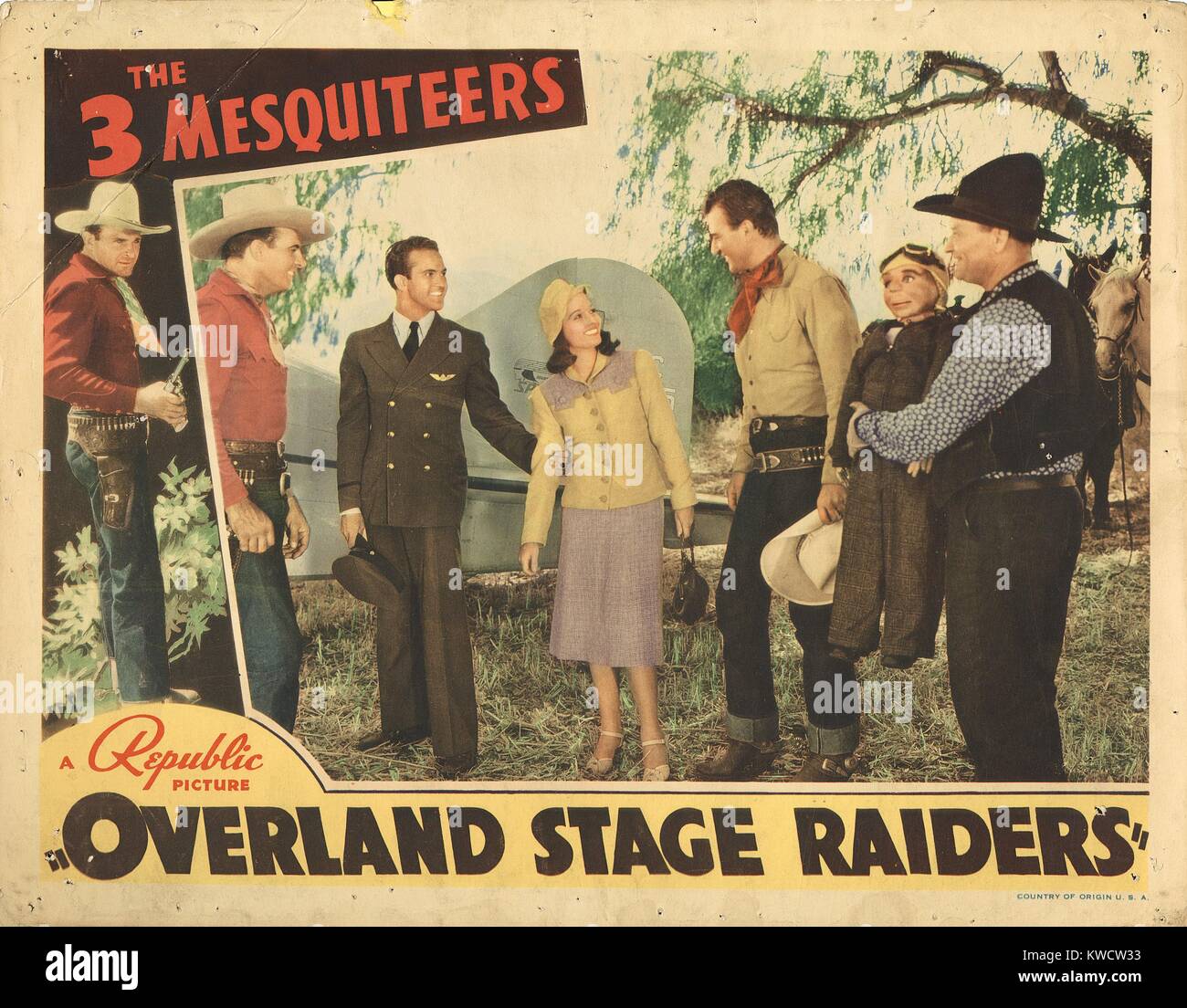 OVERLAND STAGE RAIDERS, Louise Brooks (center), John Wayne (2nd from ...