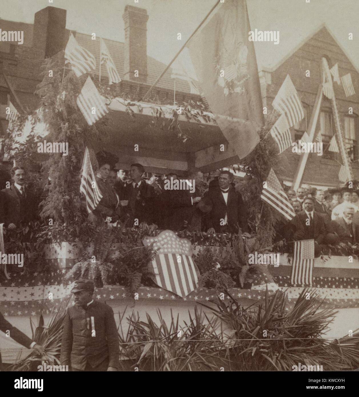 President Theodore Roosevelt and Booker Washington watching a parade at ...