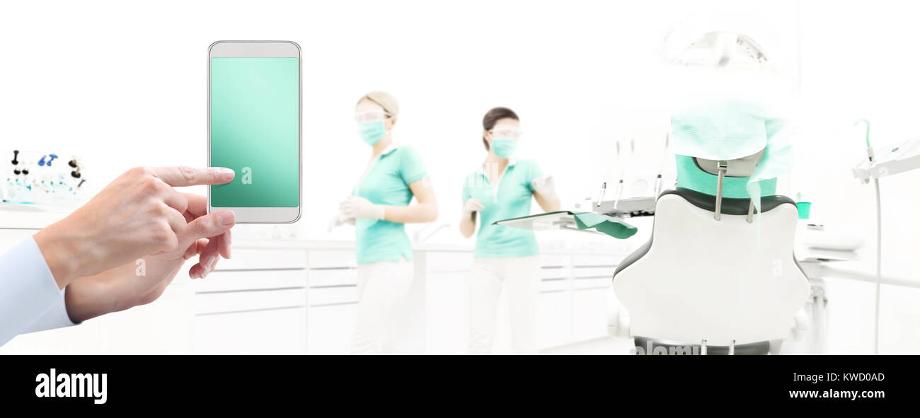 dentist hand touch smart phone pointing screen on dental clinic with ...