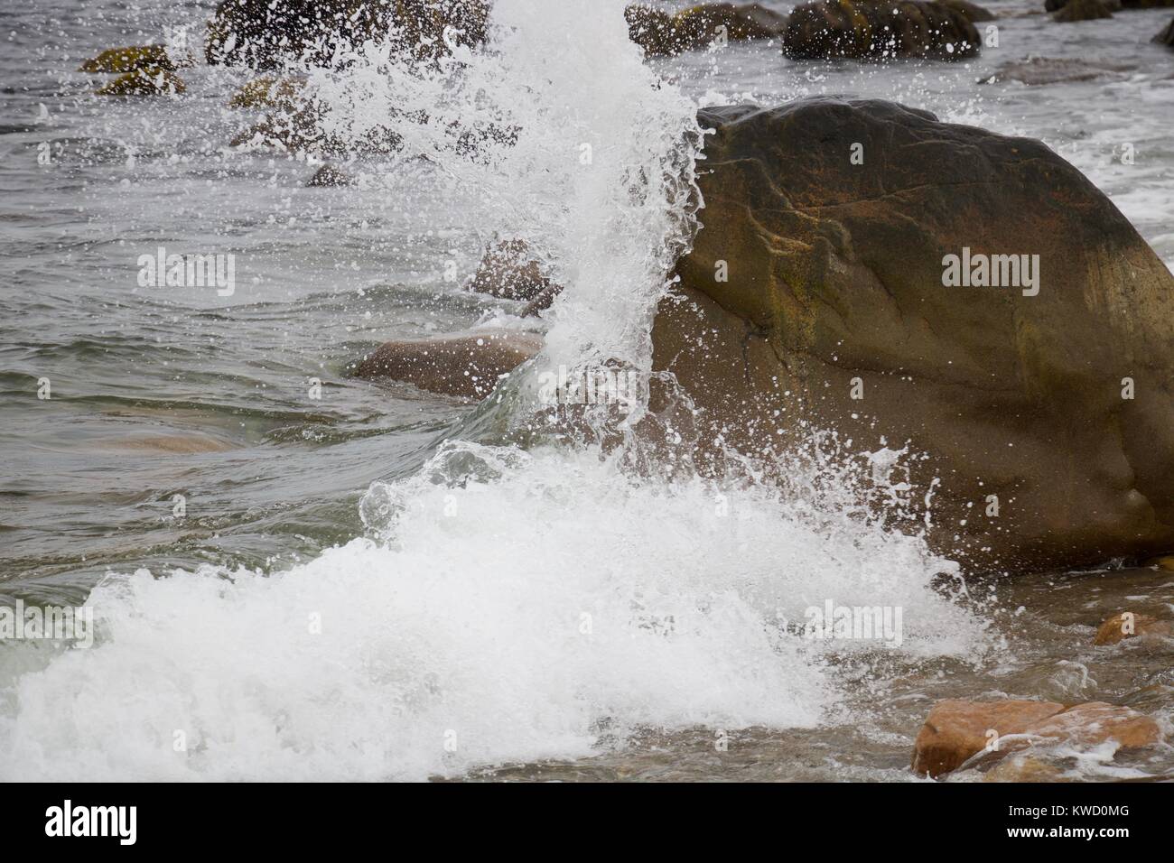 Ocean Rock in Wave Stock Photo - Alamy