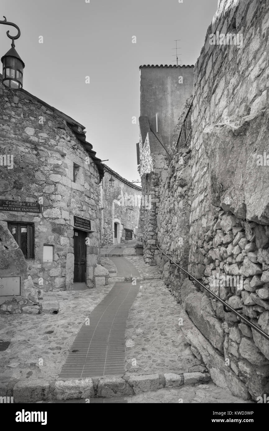 Historic cobblestone street and buildings in the medieval village of ...