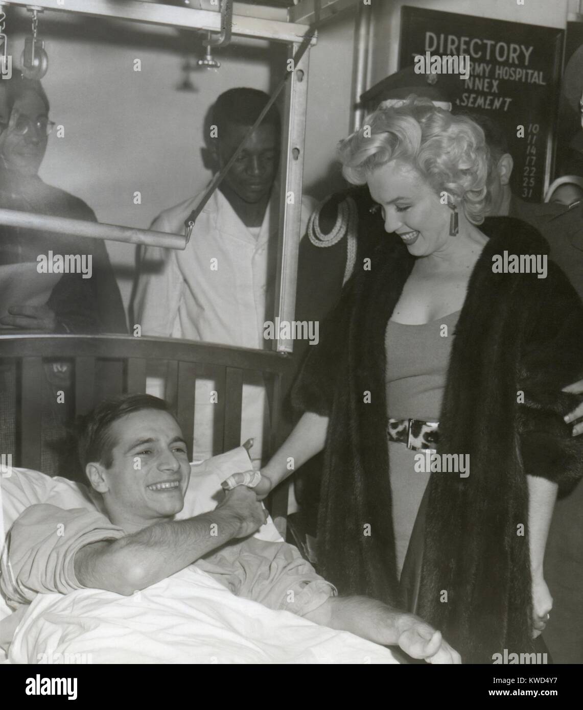 Marilyn Monroe visiting a wounded soldier in a hospital in Japan. Ca ...