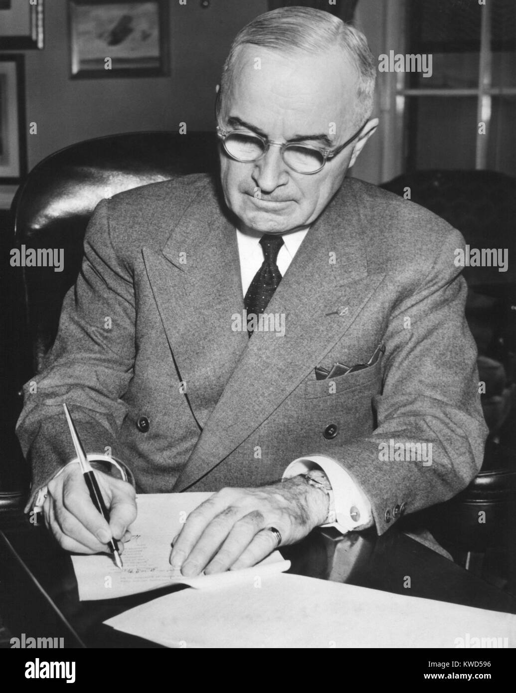 President Harry Truman at his signing a proclamation declaring a ...