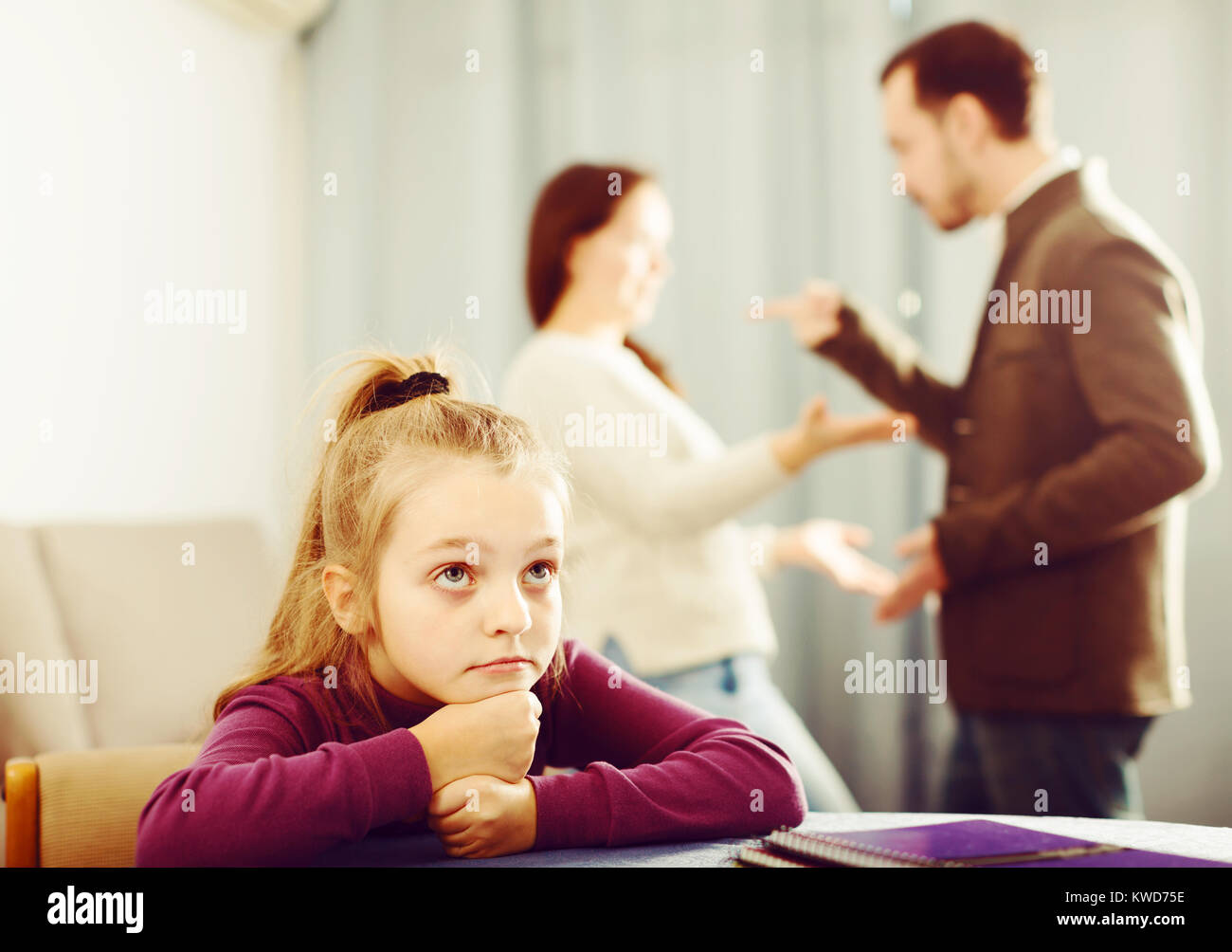 Parents arguing with each other while their daughter at home Stock ...