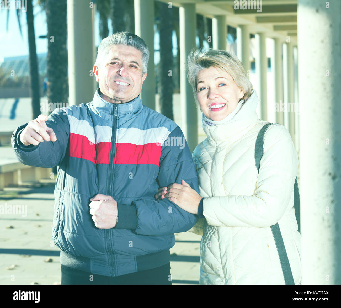 glad husband and wife have together rest and show each other hands ...