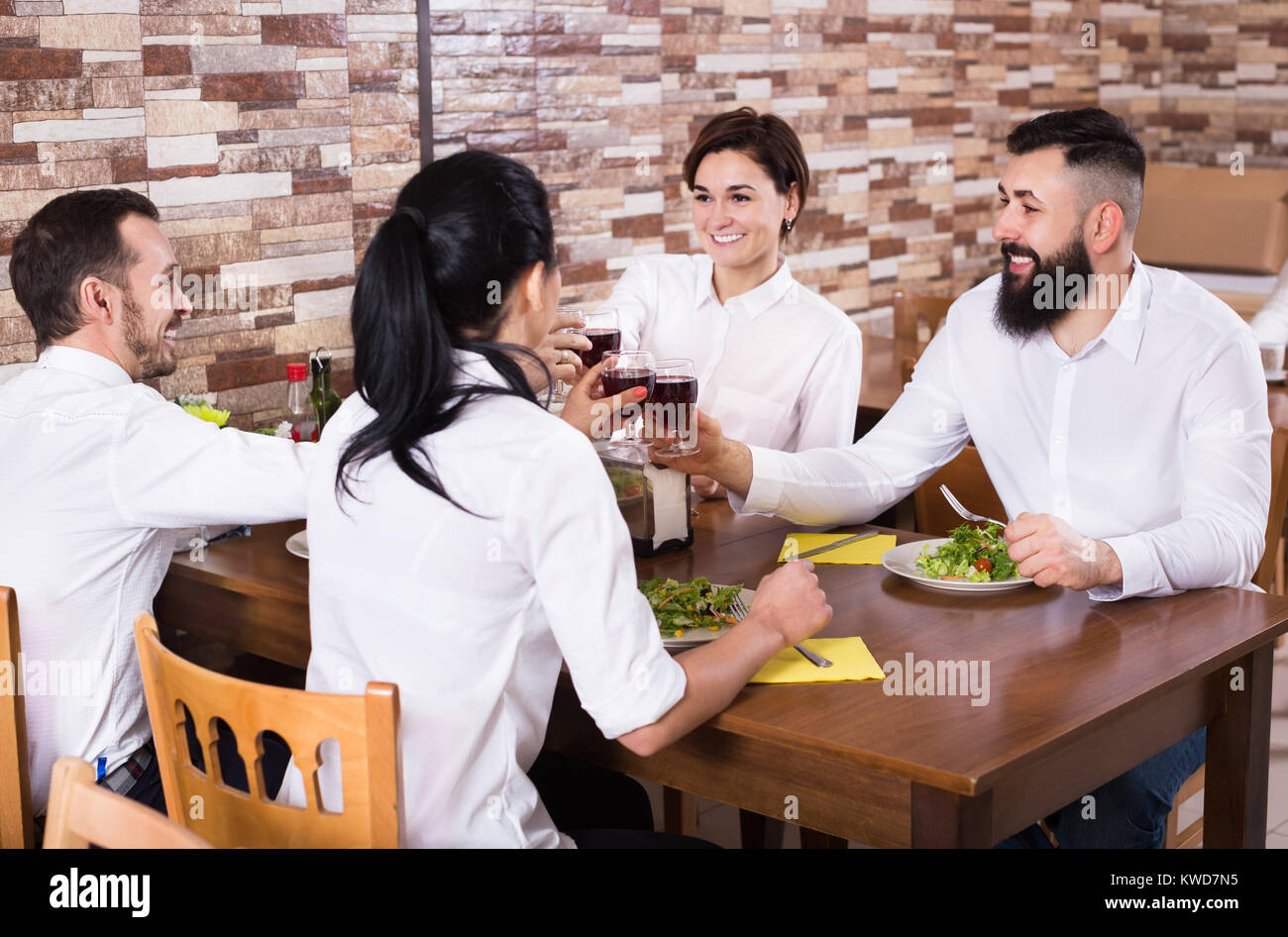 Group of people dining out merrily in the restaurant Stock Photo - Alamy