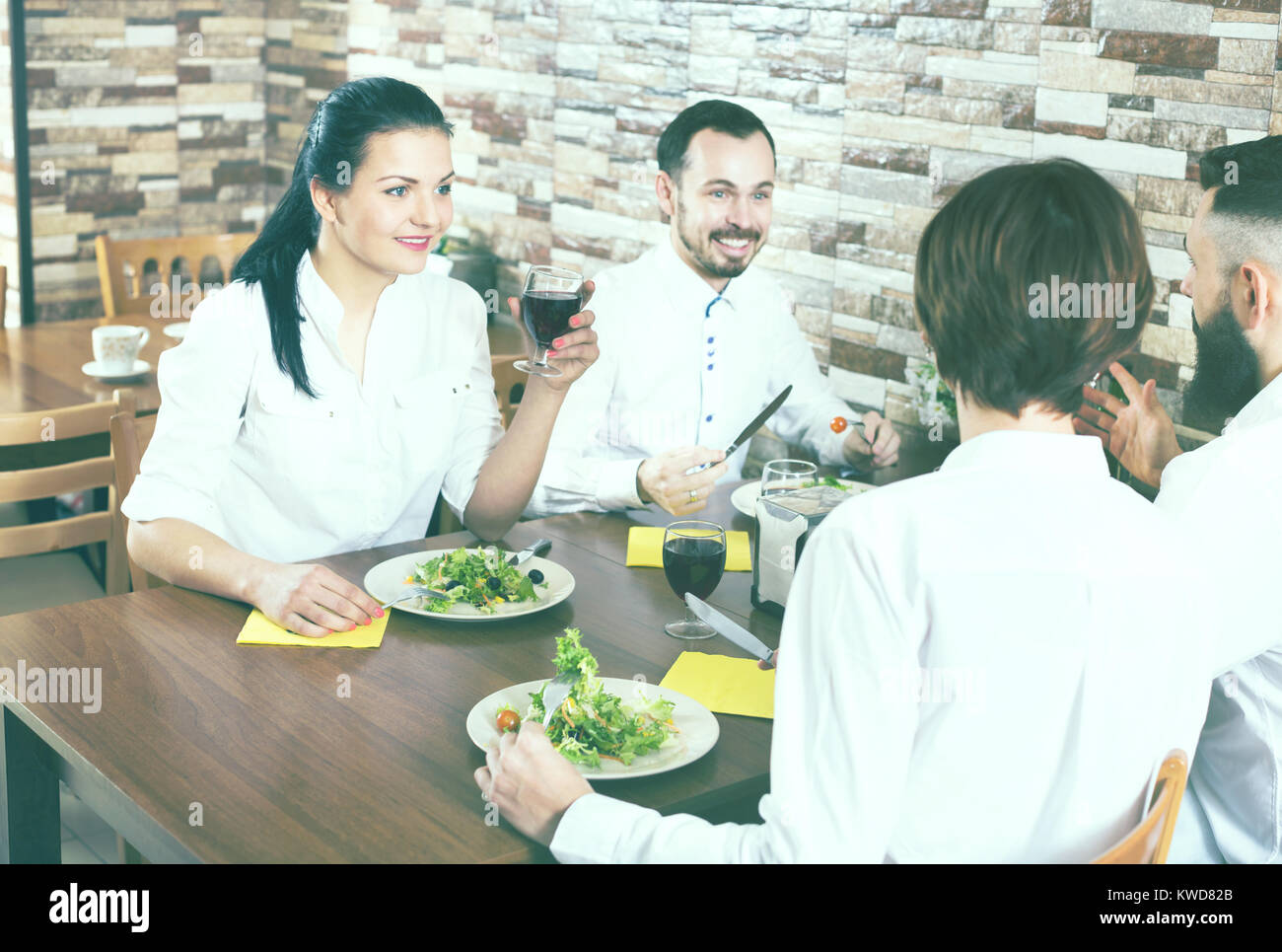 Group of happy people dining out merrily in the restaurant Stock Photo ...