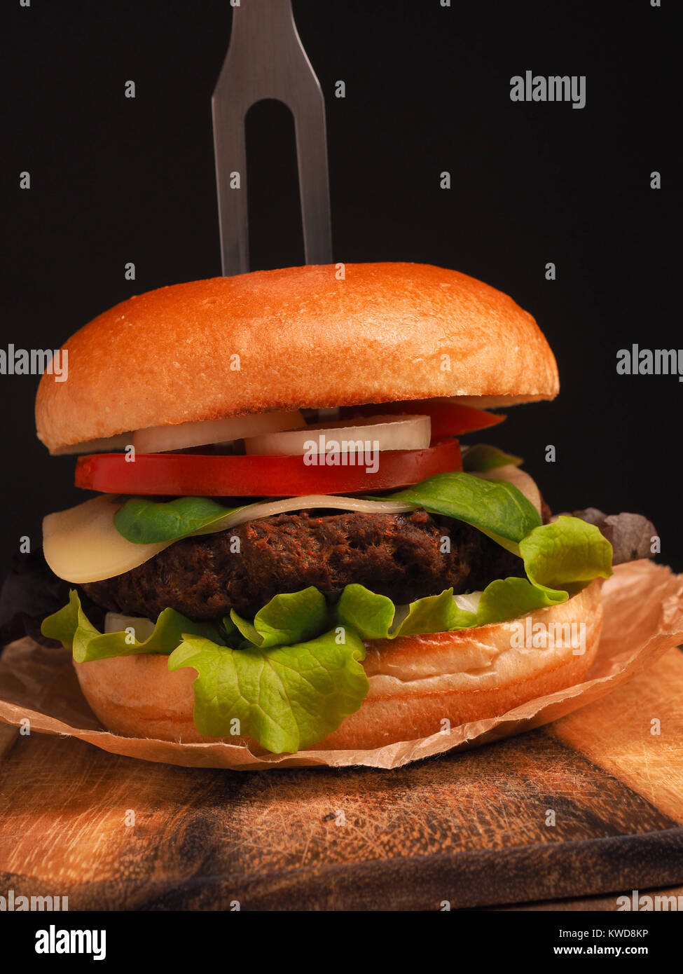 Tasty homemade burger with organic beef on a rustic wooden kitchen ...