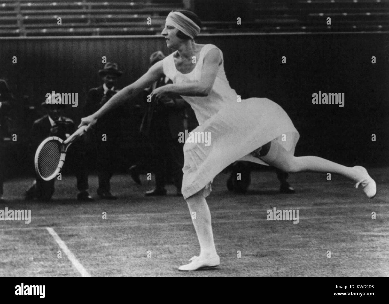 Suzanne Lenglen, swinging tennis racket on the courts of Wimbledon ...
