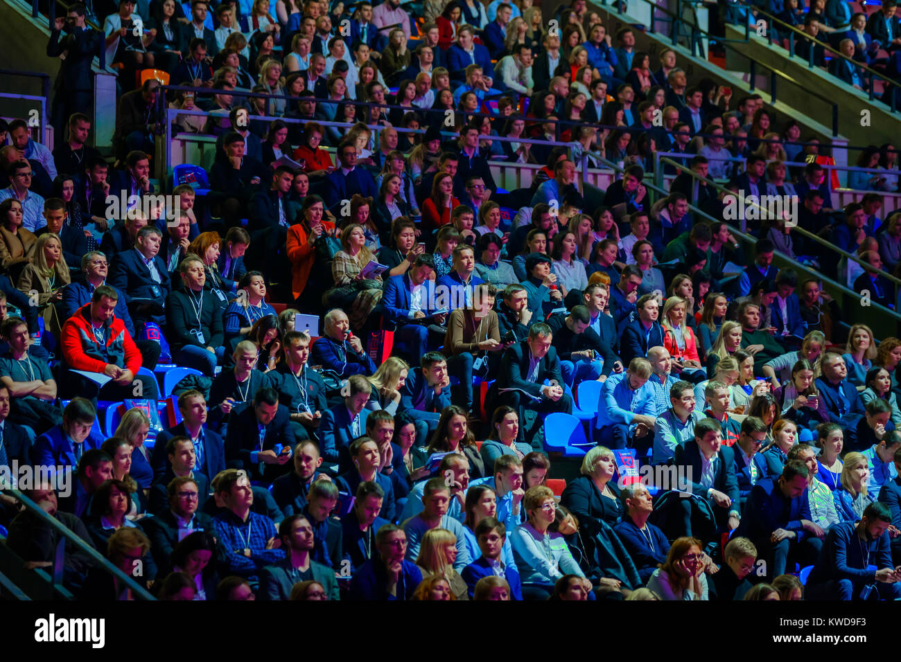People attend business conference in congress hall at Synergy Global ...