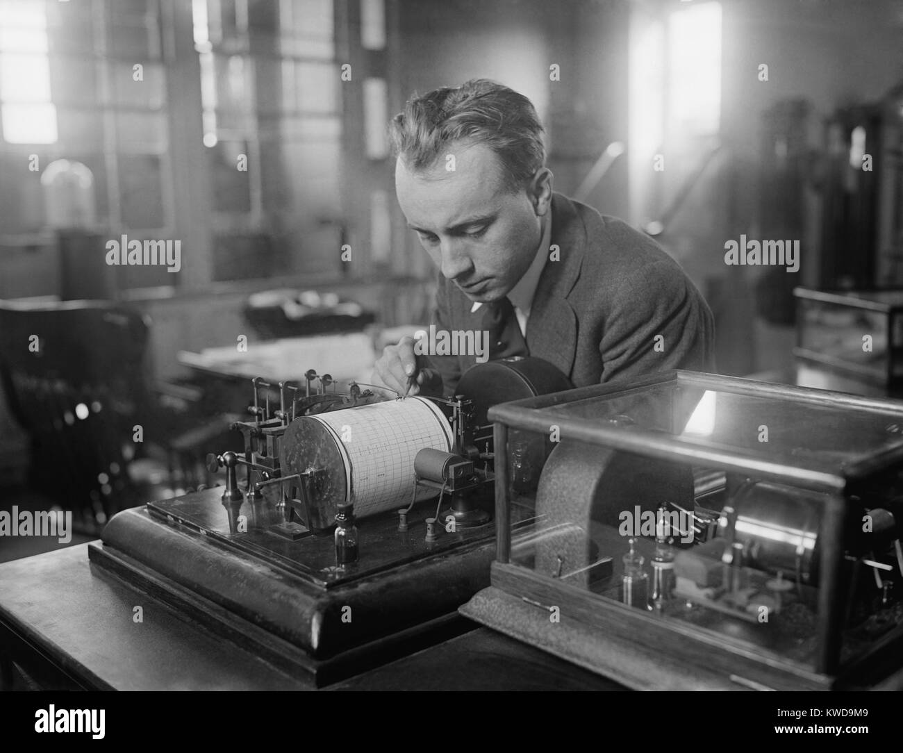 U.S. Weather Bureau Meteorologist at a meteorograph to determine wind ...