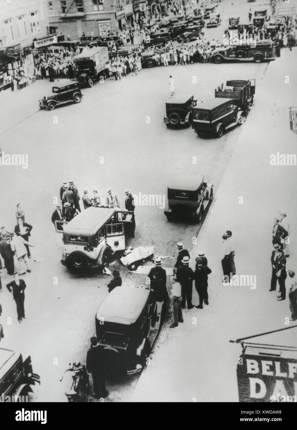 Bullet-riddled taxi and two dead gangsters in a NYC street after a gun ...