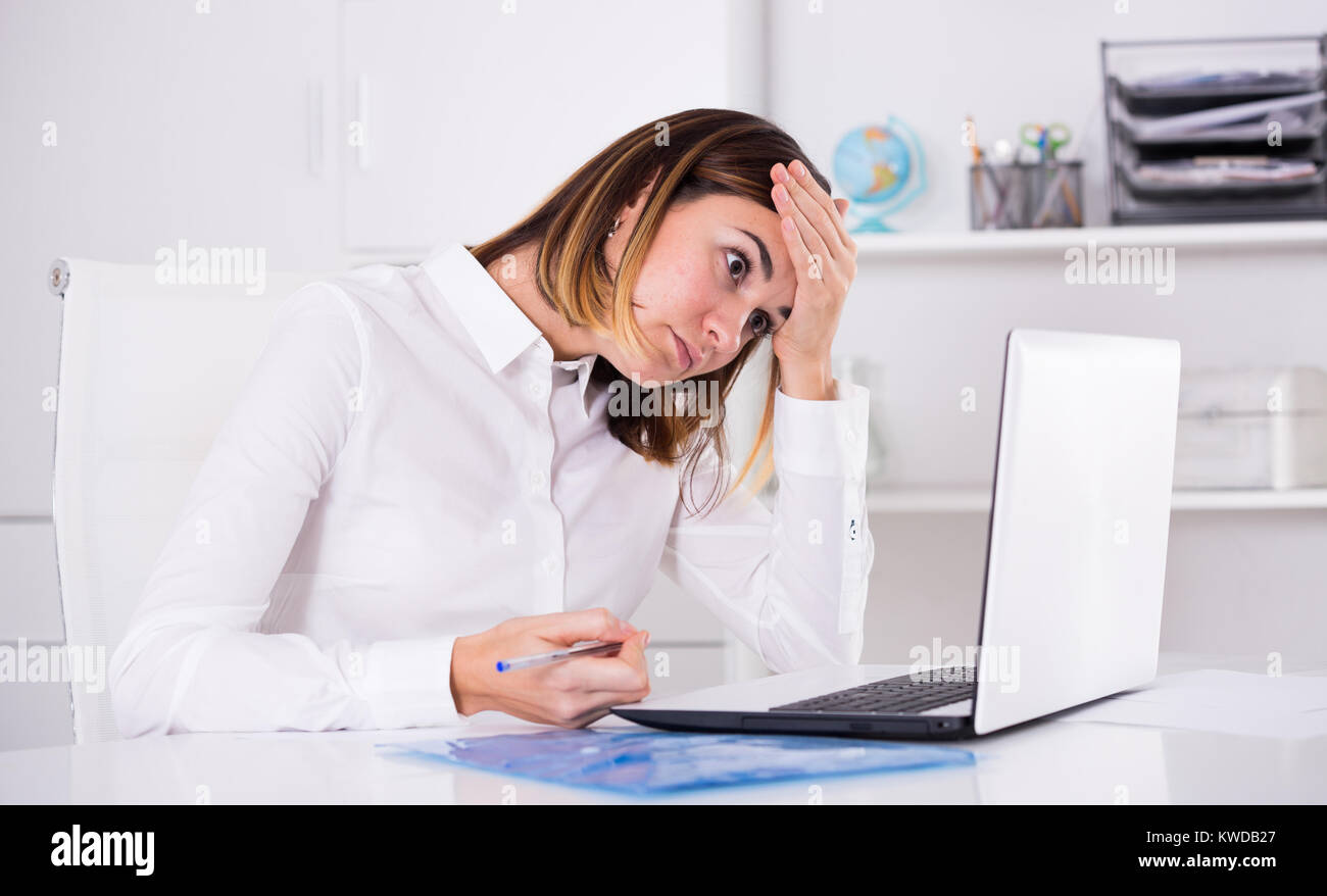 Young woman worker facing challenge in project in office Stock Photo ...