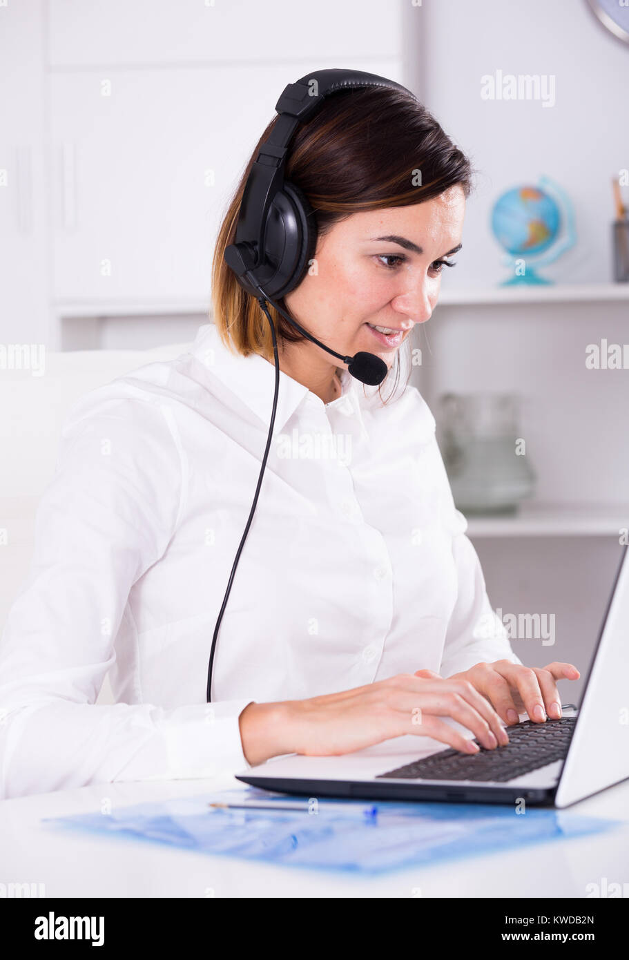Female employee having a productive day at call-centre Stock Photo - Alamy