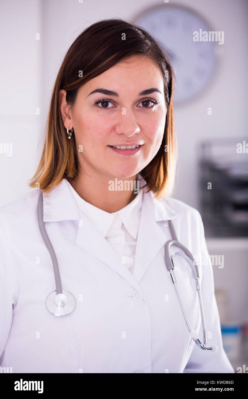 Smiling woman doctor working effectively in her office Stock Photo - Alamy
