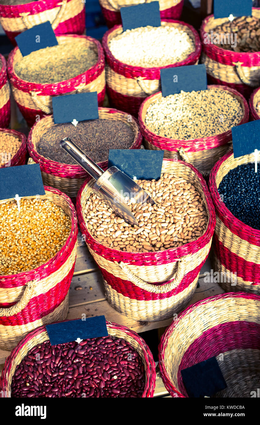 Closeup view on various beans in baskets selling on shop Stock Photo ...