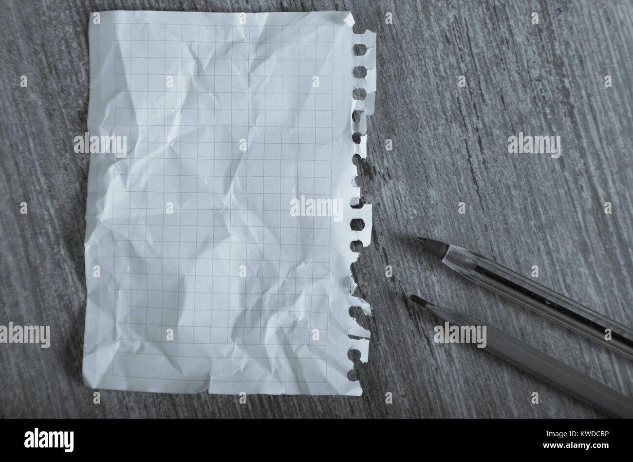 Empty crumpled page torn from notebook lying on wooden surface Stock ...