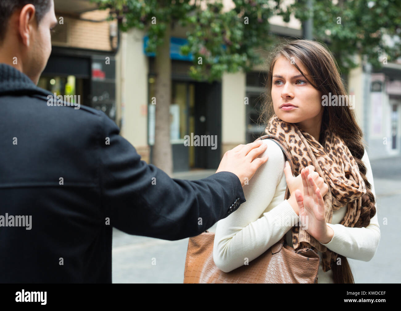 Annoying Indian guy chasing angry woman and asking attention Stock ...
