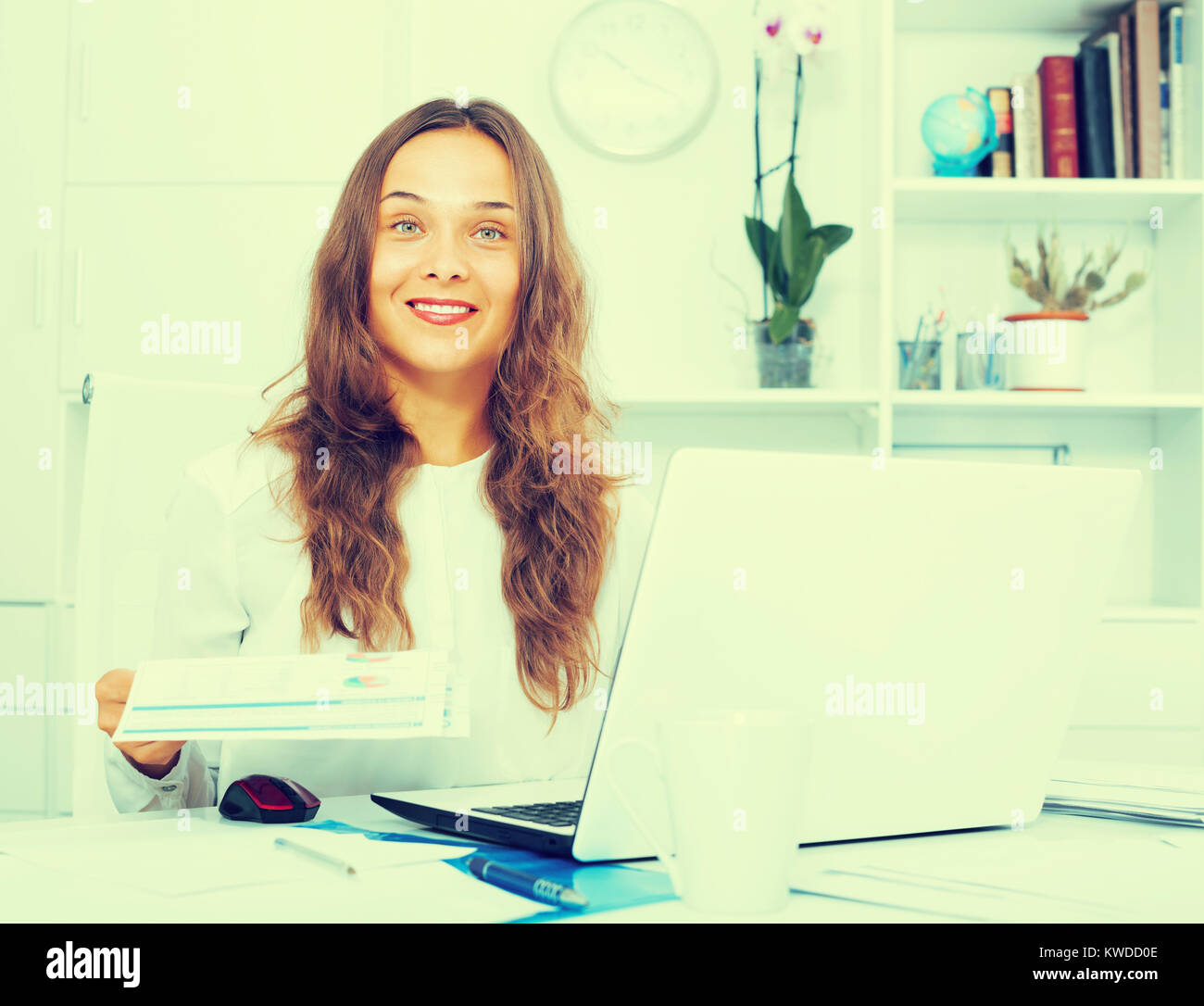 Business woman working with paper document in firm office Stock Photo ...