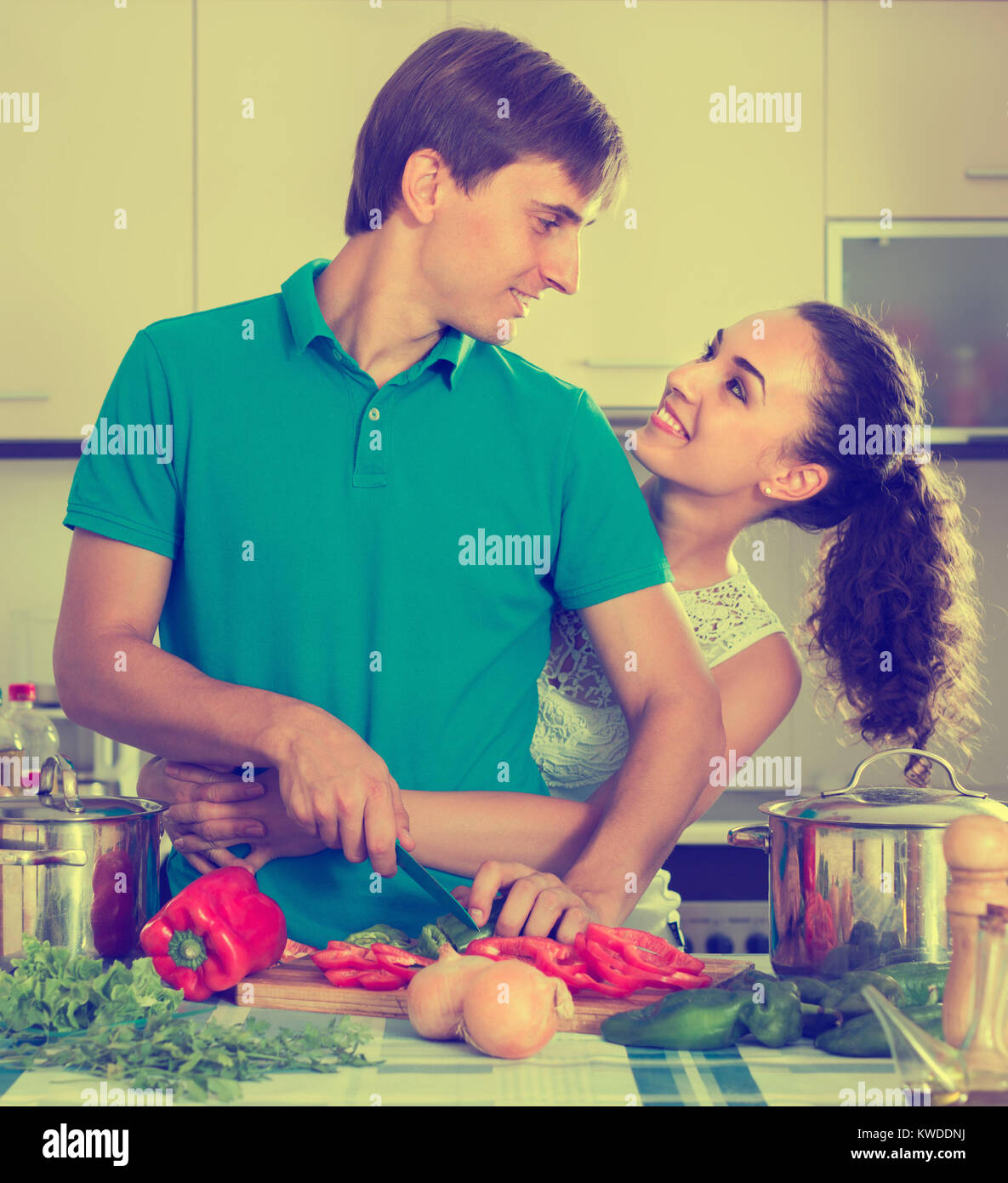 Helping her husband to prepare hi-res stock photography and images - Alamy