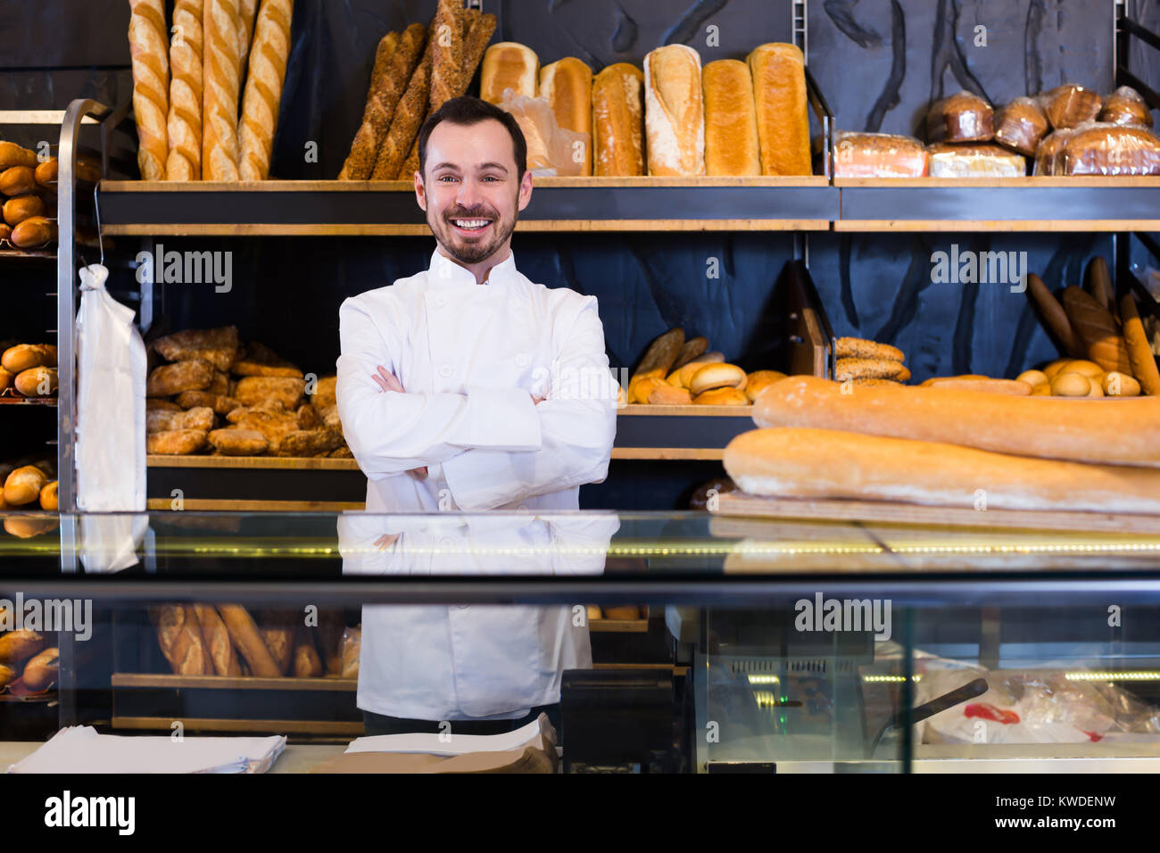 Bearded male pastry maker demonstrating pastry in bakery Stock Photo ...