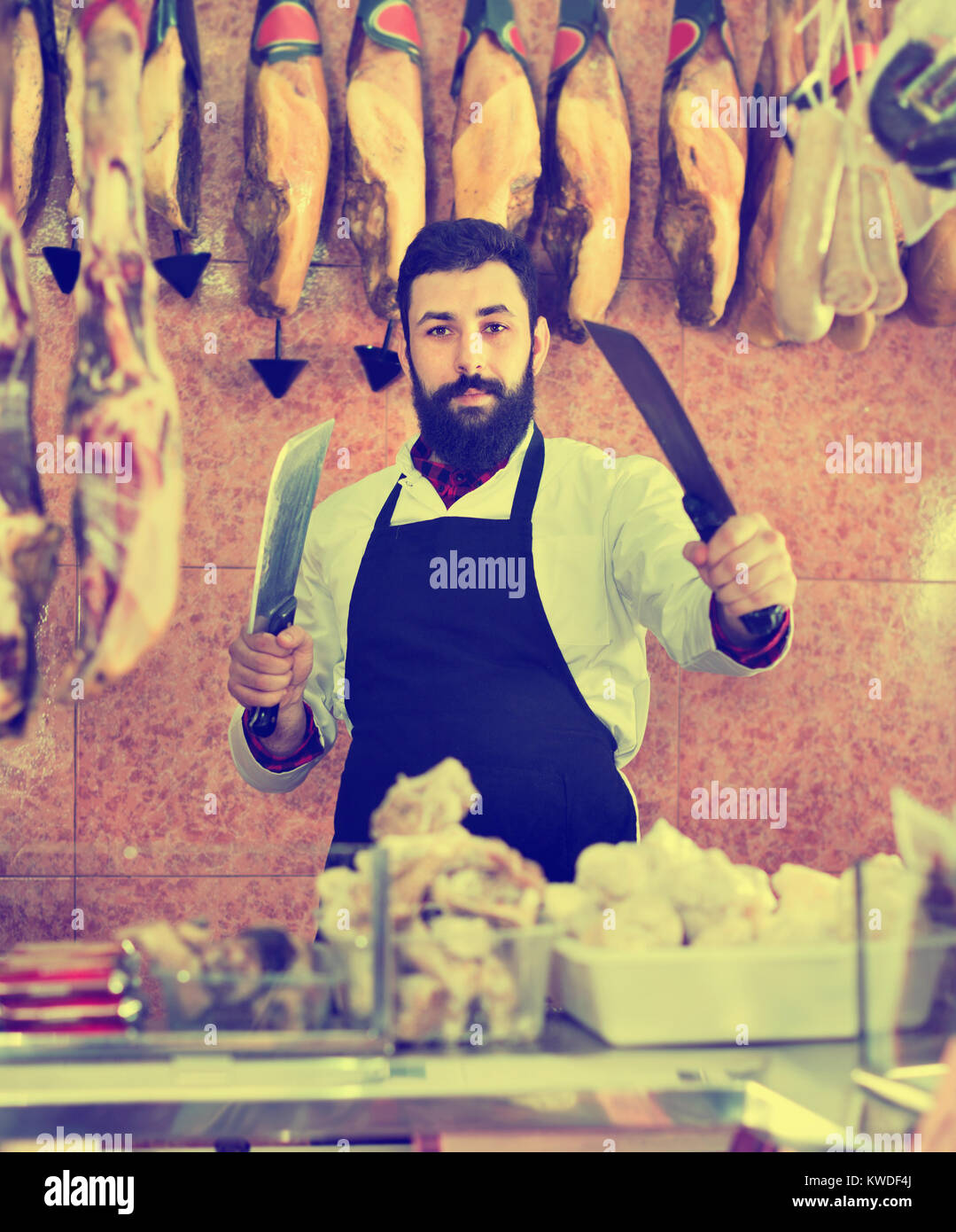 Butcher preparing meat in butchers hi-res stock photography and images ...