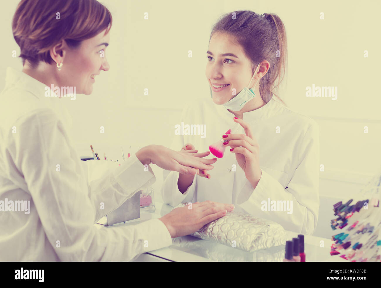 Female client doing nails in nail salon in afternoon Stock Photo - Alamy