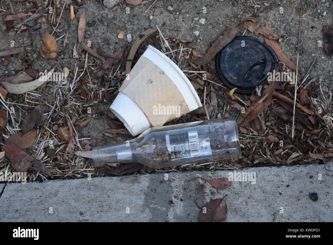 Trash on the ground Stock Photo - Alamy