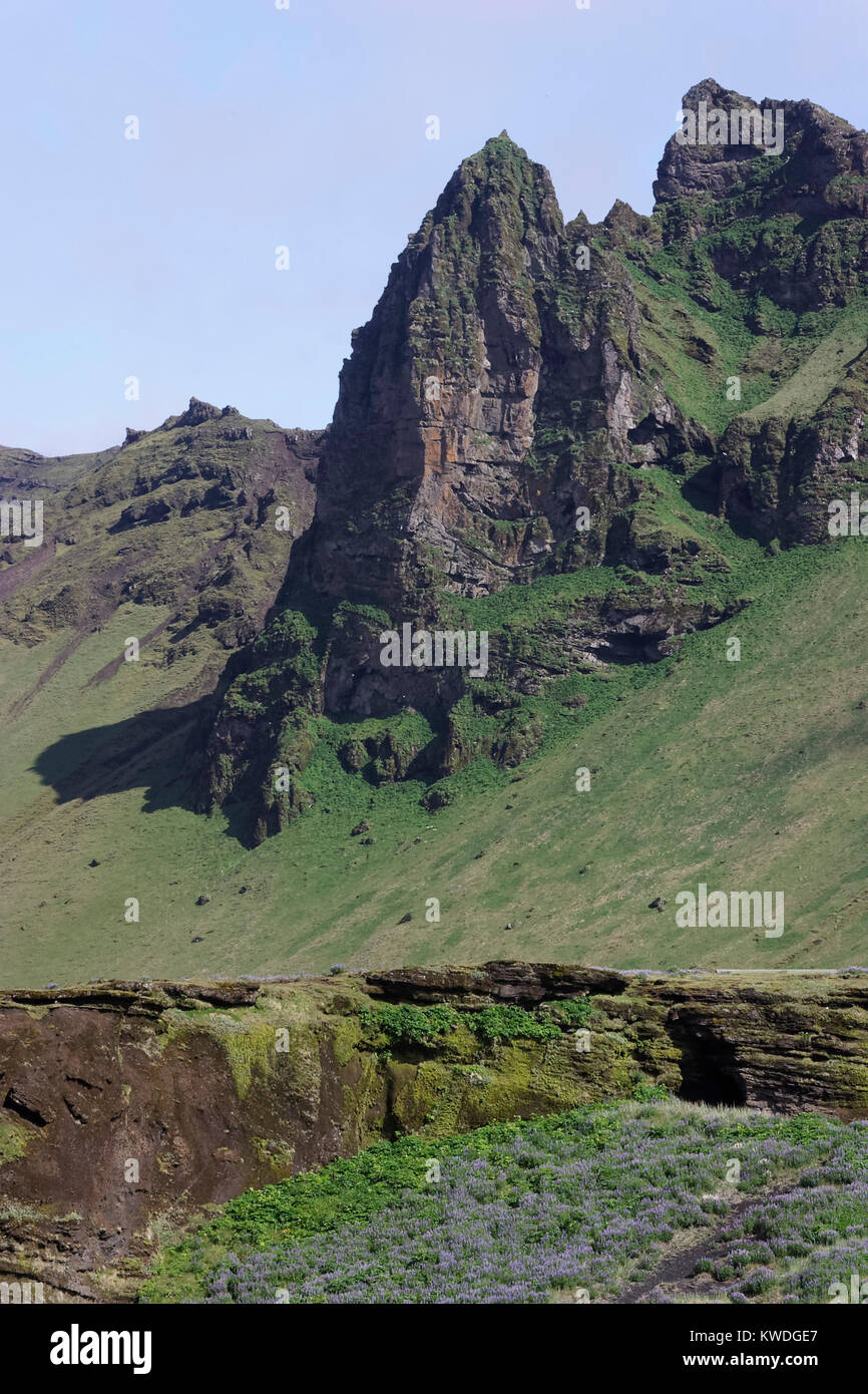 THE CLIFFS NEAR THE RING ROAD IN ICELAND HAVE MANY BEAUTIFUL WATERFALLS ...