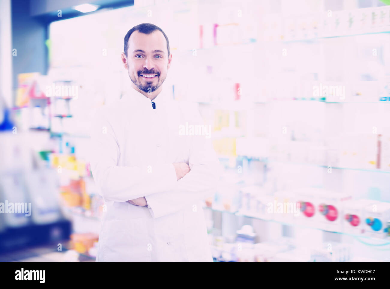 Cheerful pharmacist showing assortment of drugs in pharmacy Stock Photo ...