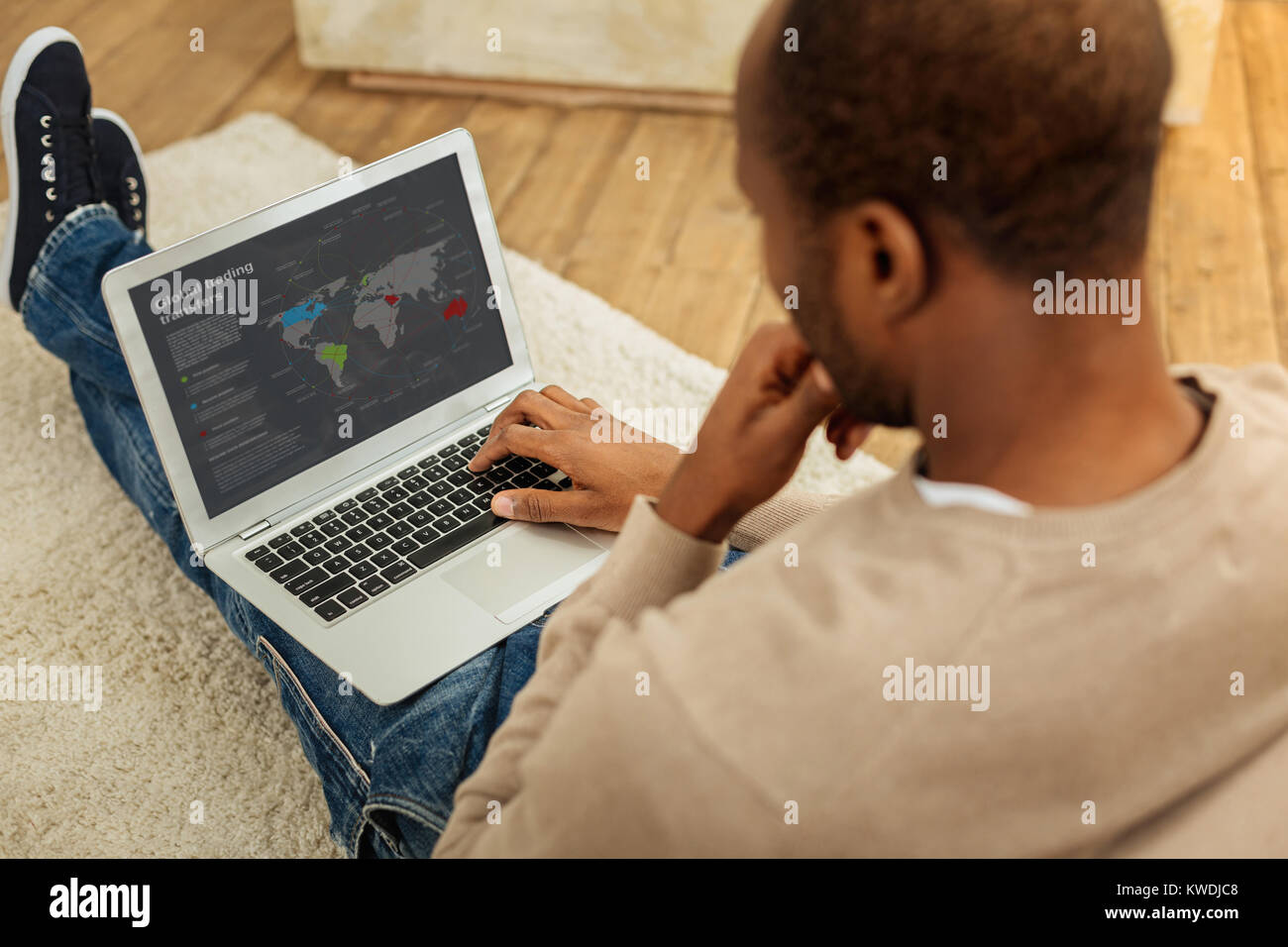 Dark-haired man searching for information Stock Photo - Alamy