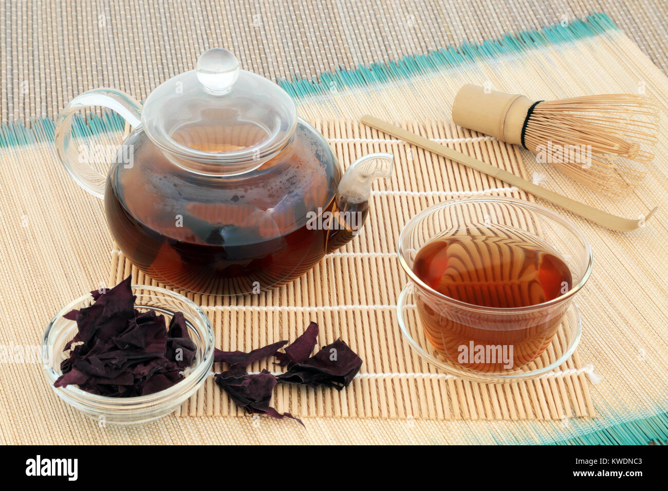 Dulse seaweed tea with glass teapot, tea cup and dried leaves with ...