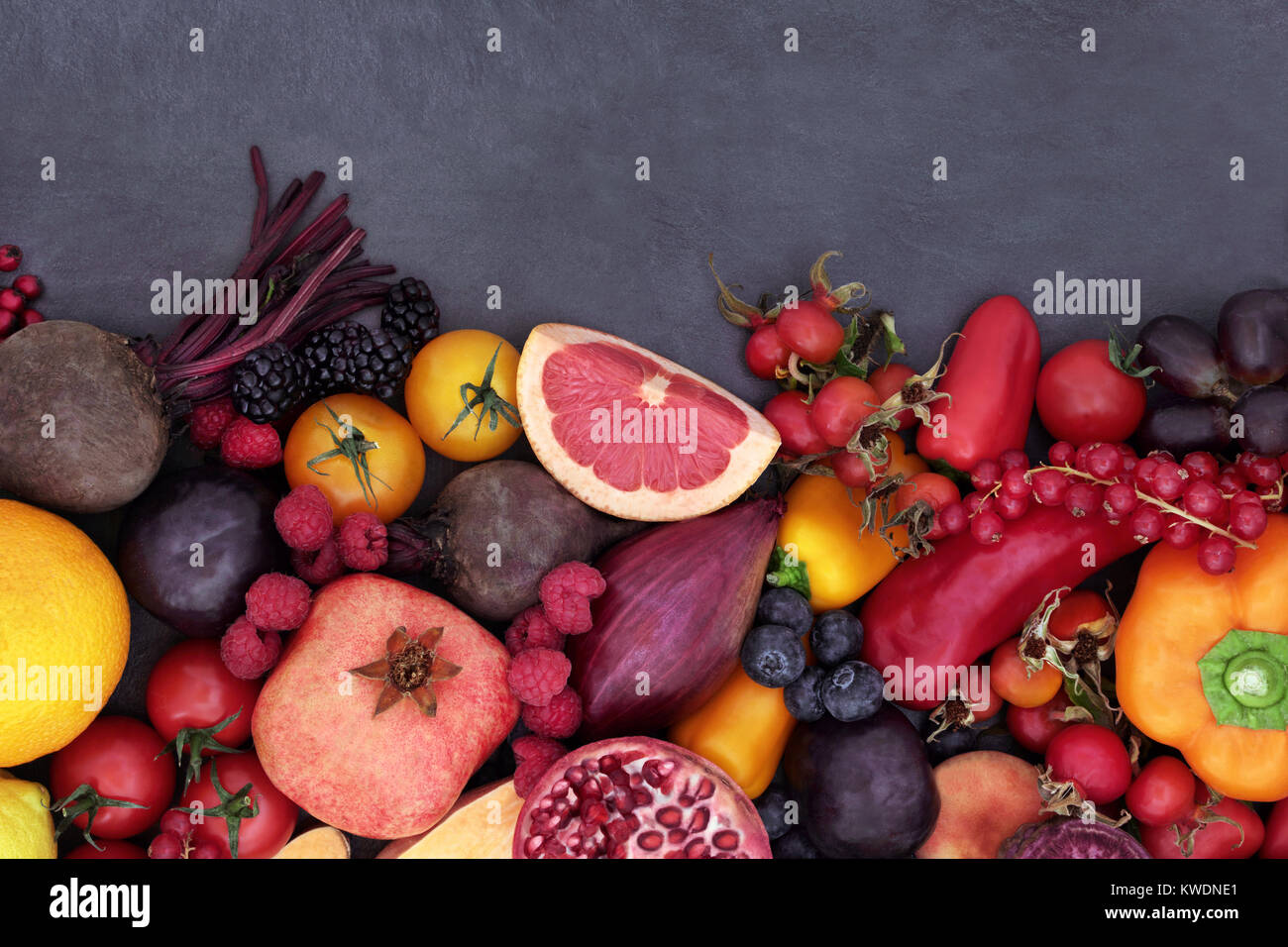 Healthy eating super food background border with fruit and vegetables ...