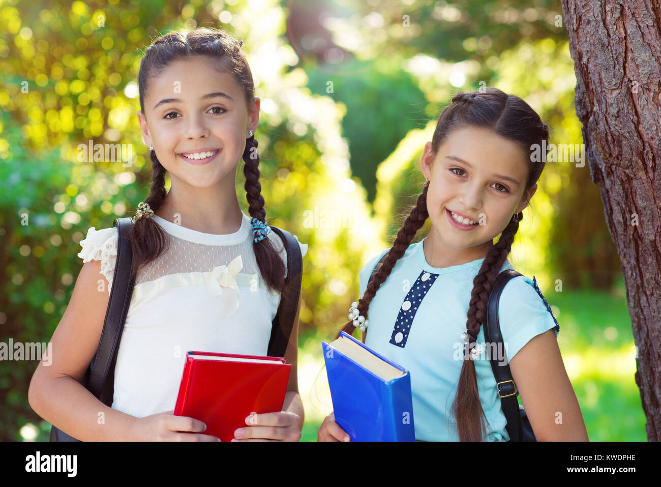 Two happy children back to school to learning and to gain knowledge ...